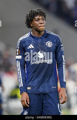 Manchester United defender Patrick Dorgu (13) in team huddle during the ...
