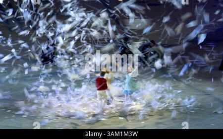 Children are surrounded by swirling paper during a tribute to Russian ...