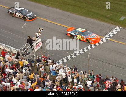 Kurt Busch crosses the finish line to win the 59th Daytona 500 on ...