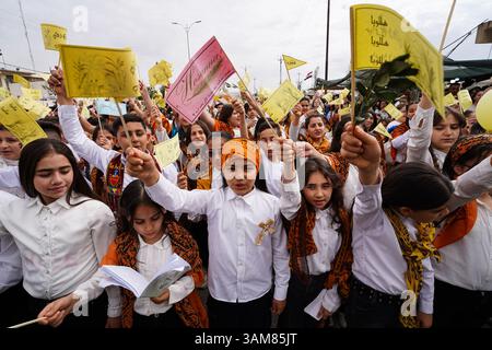 Al Hamdaniya, Iraq. 13th Apr, 2025. A child dressed in a folkloric ...