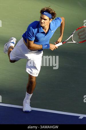 John Isner hits a shot against Nicolas Almagro during the Sony Open ...