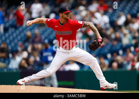 Cleveland Guardians pitcher Ben Lively delivers during the first inning ...