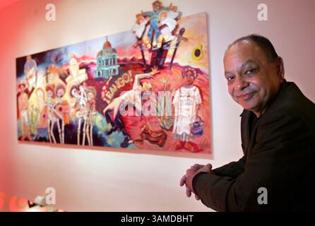 Cheech Marin sits in front of one of the paintings on view at the ...