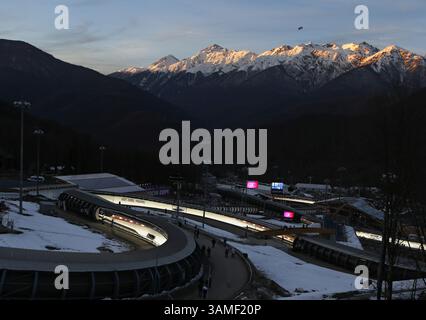 The sun sets over the Caucasus Mountains on Sunday, Feb. 23, 2014, in ...