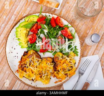 Russian french-style meat on a plate Stock Photo - Alamy