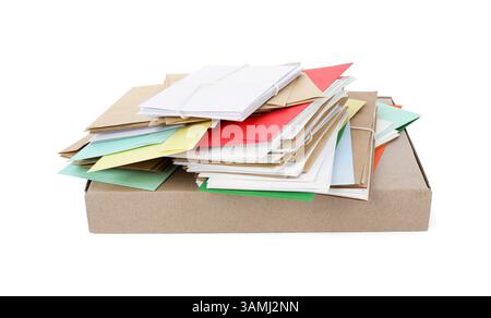 Stack of different paper envelopes and parcel on white background. Post ...