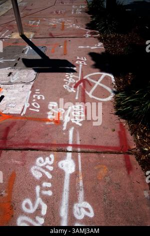 Painted Markings on the pavement for utility work to show what's ...