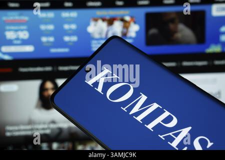 The logo of the kompas is displayed on a smartphone screen Stock Photo ...
