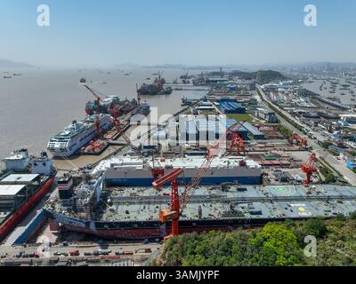 ZHOUSHAN, CHINA - APRIL 14, 2025 - Workers repair a ship at a ship ...