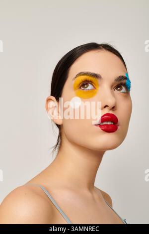 Young woman shows her vibrant personality while relaxing at home with a ...