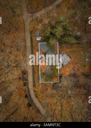 Aerial view of tranquil Vingio park with lush greenery and a dome ...