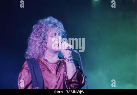 Robert Plant playing at the Hammersmith Odeon, London in the late 1980s ...