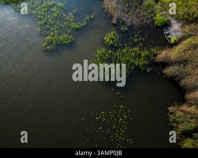 Aerial view of tranquil lake Zbaszynskie with three boats, Zbaszyn ...