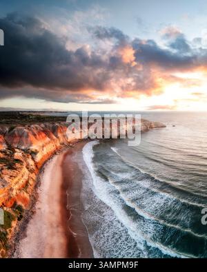 Aerial view of peaceful Maslin Beach with cliffs under a dramatic ...