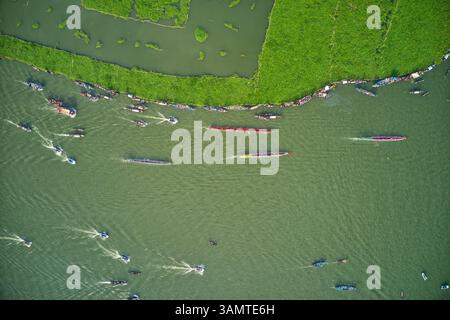 Aerial view of several traditional boats floating in Meghna river ...