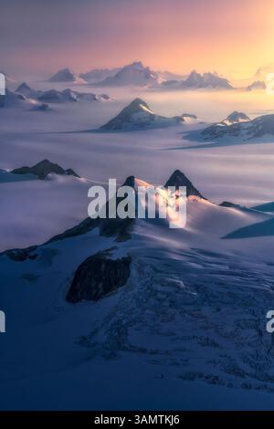 Aerial view of Juneau Ice Field bathed in evening light, looking past ...