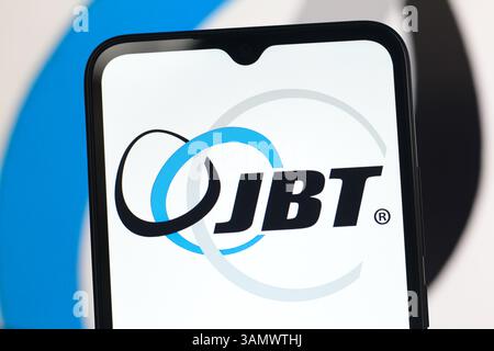 In this photo illustration, the JBT Corporation logo is seen displayed ...