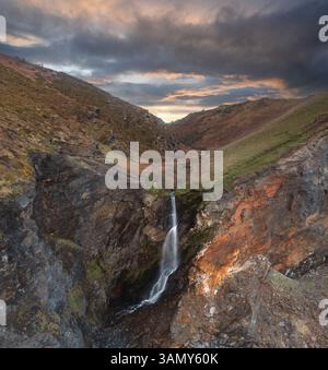 Aerial view of a waterfall along the coast, Makushin, Unalaska island ...