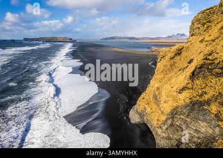Steep cliff coastline of Reynisfjara black beach, Iceland Stock Photo ...