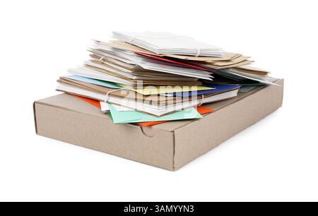 Stack of different paper envelopes and parcel on white background. Post ...