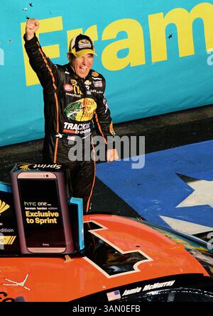 Jamie McMurray celebrates in victory lane after winning the NASCAR ...