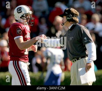 South Carolina quarterback Blake Mitchell, right, looks at his attorney ...