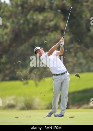 Justin Rose, of England, hits from the first fairway during the first ...