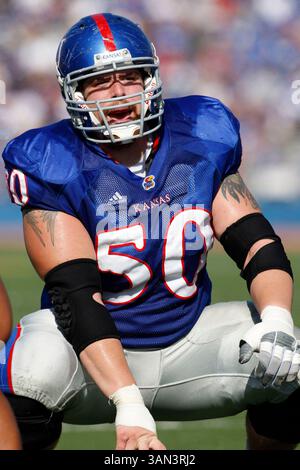 Kansas State offensive lineman Taylor Poitier (69) reaches to stop ...