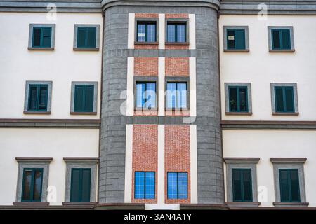 Condominium and apartment building with symmetrical modern architecture ...