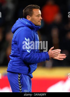 Coventry City assistant head coach Joe Edwards applauds the fans after ...