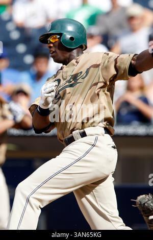 San Diego Padres center fielder Jackson Merrill leaps in vain for a ...