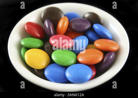 Assorted crunchy and colorful chocolate buttons in profile Stock Photo ...