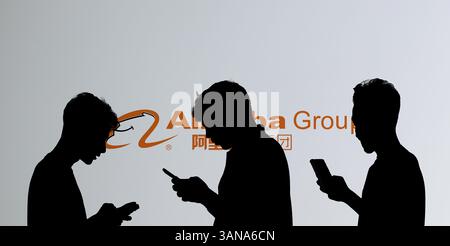 Alibaba logo on the screen smartphone. Alibaba Group Holding Limited is ...