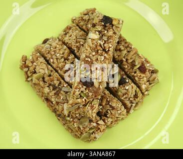 Homemade toasted muesli finger snacks and milk ready to serve Stock ...