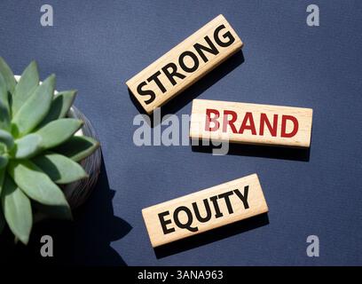 Strong brand equity symbol. Concept words Strong brand equity on wooden ...