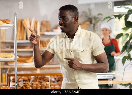 Buyer view assortment, man choose water Stock Photo - Alamy
