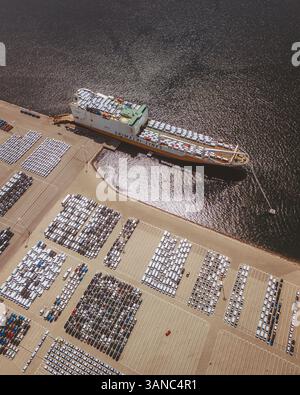 Aerial view of Setubal Port with containers, cargo ships, and cars ...