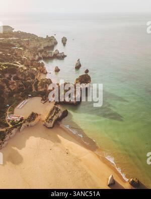 Beautiful sunset at Praia Tres Irmaos in Alvor in the Algarve Portugal ...