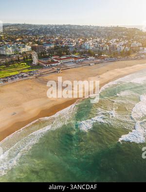 Aerial view of beautiful Bondi Beach with cliffs and urban cityscape at ...