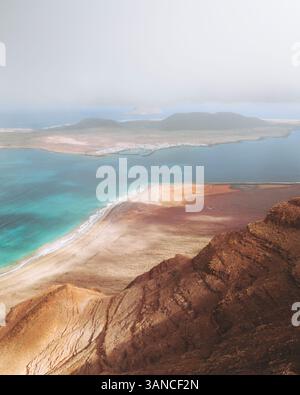 Breathtaking view of La Graciosa Island and waving sea from Mirador del ...