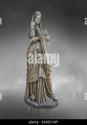 Roman statue of a standing woman wearing a long flowing tunic. Vatican ...