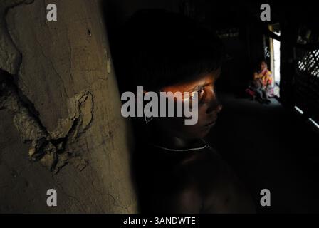Oct. 3, 2009 - Sunderbans, West Bengal, India - Impoverished boy in his makeshift house. (Credit ...