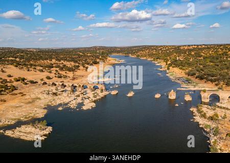Aerial view of Puente Ayuda, a collapsed stone bridge crossing the ...