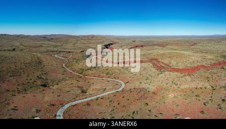 Aerial view of winding Weano Road through vast and rugged landscape ...