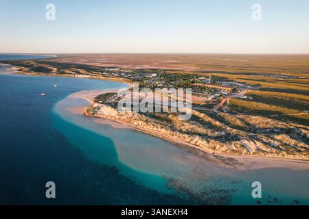 Aerial view of beautiful Bills Bay with beach goers and Ningaloo Reef ...