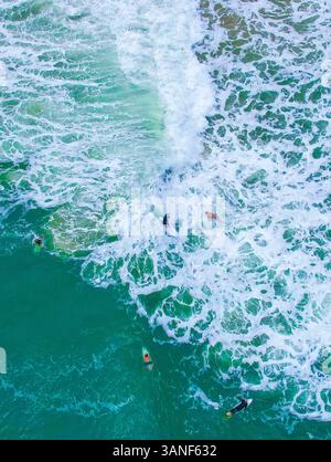 Aerial view of surfers at Dolphin Point Lookout, Tea Tree Bay, Noosa ...
