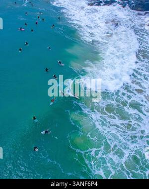 Aerial view of surfers at Dolphin Point Lookout, Tea Tree Bay, Noosa ...