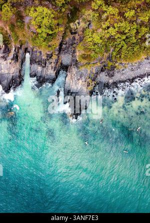 Aerial view of surfers at Tea Tree Bay Beach, Noosa Heads, Queensland ...