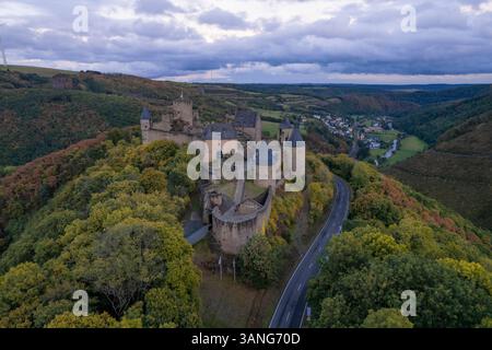 Aerial drone view of Bourscheid castle on forest hill top with ...
