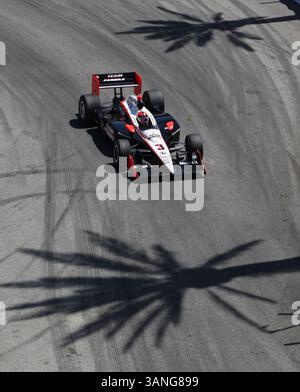 Helio Castroneves, of Brazil, drives during the IndyCar Grand Prix auto ...